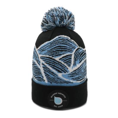 China Custom Jacquard Woven Patch Hockey Pompom Beanie 58cm Acrylic Winter Hat for sale