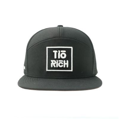 China Custom 7 Panel Rubber Baseball Cap 58cm Laser Cut Perforated Snapback Hat for sale
