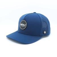 China Unisex Custom Navy Blue Baseball Cap With PVC Rubber Patch Logo And Waterproof Design for sale