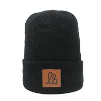 China Unisex Ribbed Winter Beanie Hat 58cm Adult Size Custom Logo Knitted Ski Cap for sale