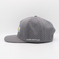 China Custom 5 Panel Waterproof Baseball Cap with Rubber PVC Logo Laser Cut Holes 56-60cm Adult Size for sale