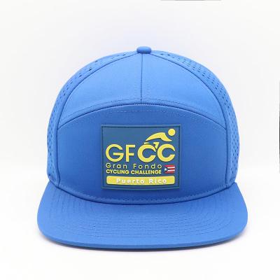 China Custom Waterproof 7 Panel Laser Cut Hole Snapback Cap Hat with Rubber Patch 56-60cm Adult Size for sale