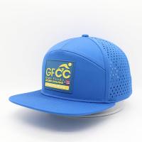 China Custom Waterproof 7 Panel Laser Cut Hole Snapback Cap Hat with Rubber Patch 56-60cm Adult Size for sale