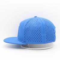 China Custom Waterproof 7 Panel Laser Cut Hole Snapback Cap Hat with Rubber Patch 56-60cm Adult Size for sale