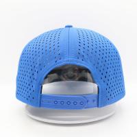 China Custom Waterproof 7 Panel Laser Cut Hole Snapback Cap Hat with Rubber Patch 56-60cm Adult Size for sale