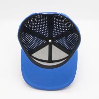 China Custom Waterproof 7 Panel Laser Cut Hole Snapback Cap Hat with Rubber Patch 56-60cm Adult Size for sale
