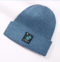 China Knitted Winter Hat Made From Recycled PET Bottles With Woven Patch And Custom Design for sale