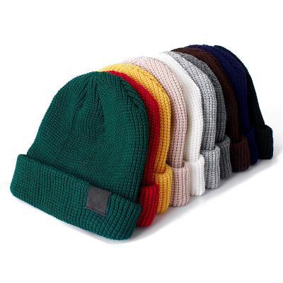 China Custom Woven Label Eco Friendly RPET Acrylic Wool Unisex Cuffed Skull Cap Beanie Waffle Knitted Hat for sale