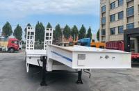 China 4-Axle Low-Flat Semi-Trailer with 120-ton Load Capacity and High-Strength Steel Main Beam for Heavy-Duty Transportation for sale