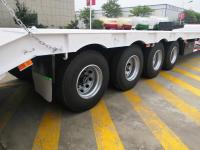 China 4-Axle Low-Flat Semi-Trailer with 120-ton Load Capacity and High-Strength Steel Main Beam for Heavy-Duty Transportation for sale