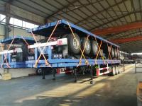 China 12R225 Tubeless Tires Flat Bed Semi Trailer Mechanical Suspension Heavy Duty Steel Flatbed Trailer for Cargo Transport for sale