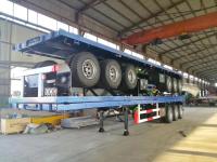 China 12R225 Tubeless Tires Flat Bed Semi Trailer Mechanical Suspension Heavy Duty Steel Flatbed Trailer for Cargo Transport for sale
