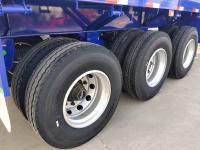 China 3Axle 13t Flat Bed Semi Trailer Heavy Load Flatbed Semi Truck Trailer Built for Hauling of Machinery and Oversized Cargo for sale