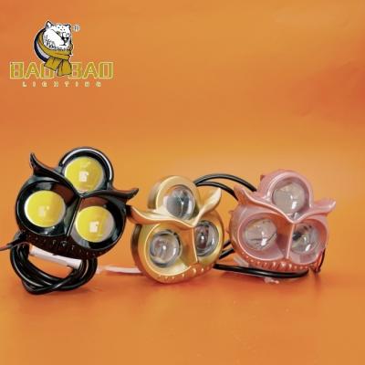 China Owl Light 3 Eyes White Yellow Dual Color Flash Plastic Iron Aluminum LED Fog Light Headlamp For Motor for sale