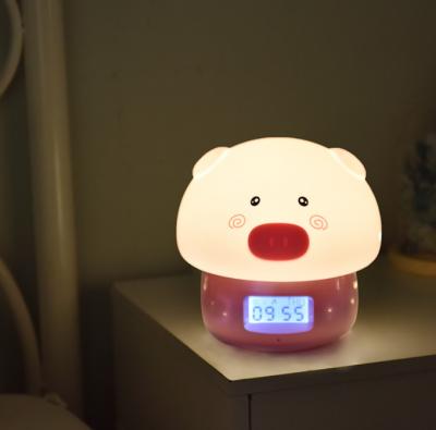 China Kids Alarm Clock with LCD Display 50000h Battery Life 450g Intelligent Pig Design Silicone for sale