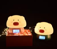China Kids Alarm Clock with LCD Display 50000h Battery Life 450g Intelligent Pig Design Silicone for sale