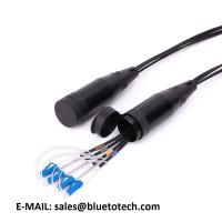 China Waterproof Tactical LC to LC 4Fiber Fiber Optic Patch Cord with Metal Cable Trolly for Outdoor Armored Applications for sale