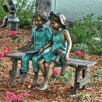 China Metal Life Size Bronze Kids Children Sculpture Girls Lying And Reading Statue for Decor for sale