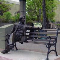 China Sitting On Park Bench Embracing Life Size Bronze Couple Statue Man And Woman Sculpture For Sale for sale