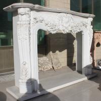 China Indoor Marble Sculpture French Fireplace with Black Insert and Custom Hand Carving for sale