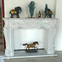 China Antique French Modern Interior Decoration Hand Carved Electric Louis XVI Marble Fireplace Surround for Indoor Home Decoration for sale