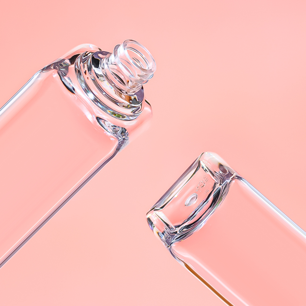 The cosmetic bottle has a clear and thick-walled body.