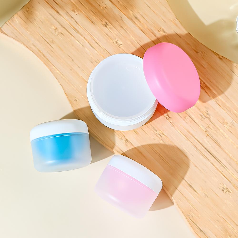 Open round PP cream jar showing wide mouth and matte pink lid.