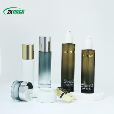 China Custom Round Glass Bottle for Lotion Cream Serum Cosmetic Packaging for sale