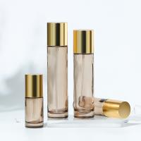 China High-quality transparent glass cosmetic bottle with gradient paint and customized logo for lotion packaging for sale