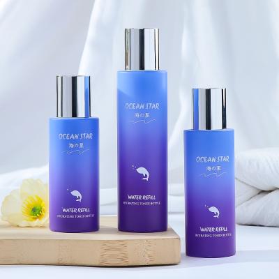 China Gradient Plastic Essence Bottle with Gold/Silver Plated Cap and High Impact Resistance for Premium Skincare Packaging for sale