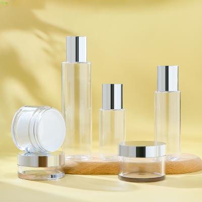 China Refillable Cream Jar and Toner Bottle Set with Electroplated Silver Cap and Premium Transparency for Skincare Packaging for sale