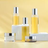 China Refillable Cream Jar and Toner Bottle Set with Electroplated Silver Cap and Premium Transparency for Skincare Packaging for sale