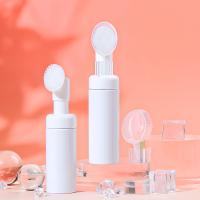 China 100ml Foam Pump Bottle with Silicone Brush for Refillable Facial Cleanser Packaging for sale
