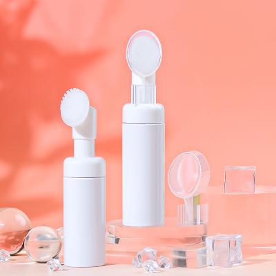 China 100ml Foam Pump Bottle with Silicone Brush for Refillable Facial Cleanser Packaging for sale