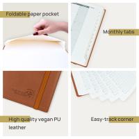 China Brown Softcover Spiral Planner 2023 6.5x8.5in Daily Weekly Schedule Custom Paper Pocket for sale