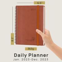 China Brown Softcover Spiral Planner 2023 6.5x8.5in Daily Weekly Schedule Custom Paper Pocket for sale