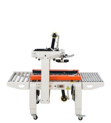 China 6-12 mm Sealing Width Automatic Top And Bottom Drive Belt Adhesive Tape Sealer Case Box Carton Sealing Machine for sale