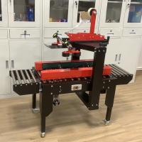 China Electric Driven Semi Automatic Case Carton Box Taping Sealer with Sole Universal Wheel for sale