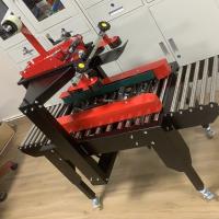 China Electric Driven Semi Automatic Case Carton Box Taping Sealer with Sole Universal Wheel for sale