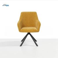 China Elegant Yellow Rotating Dining Chair with Fabric Cover and Iron Frame Modern Style for sale