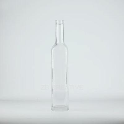 China 500ml High White Glass Whisky Bottle With Cork Top For Premium Spirits Packaging 520G CY-777 for sale