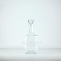 China 500ml Flint Glass Liquor Bottle with Engraved Design and Cork Finish for Premium Spirits for sale