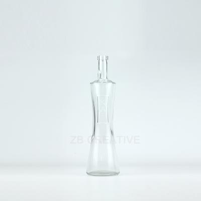 China 750ml Custom Engraved Flint Glass Bottle with Cork Finish for Premium Spirits for sale