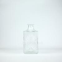 China 1000ml Flint Engraved Glass Liquor Bottle Cork Finish Premium Spirits Packaging for sale
