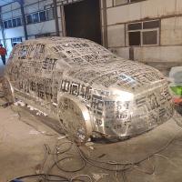 China Hollow Text Car Model Sculpture Stainless Steel New Energy Vehicle Statue for sale