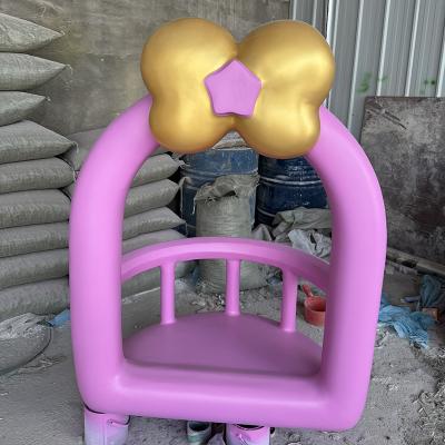 China Amusement Park Outdoor Landscape Sculptures Cartoon Bow Kids Photo Chair Prop for sale