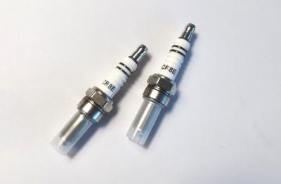 China Tricycle Motorcycle Engine Spark Plug CR8E 10mm Thread Black White Orange Colors for sale