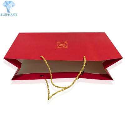 China Red Gift Bags With Handles 18×13×7cm Recycled Paper Merchandise Bags for sale