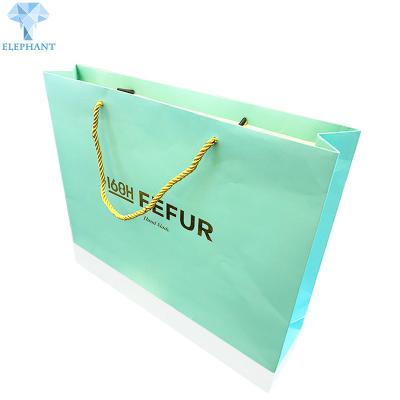 China Green C2S Art Paper Gift Bags With Handles Biodegradable for sale