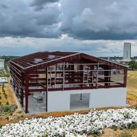 China Prefabricated Steel Warehouse Building 30m Wide Span with Wall Cladding Options for sale